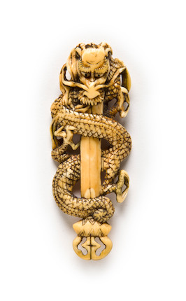 Bonhams : An ivory netsuke of a dragon on a ken Edo period, 18th century