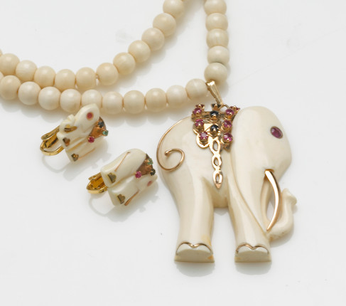 Bonhams : An ivory, gem-set, 14k, 10k gold and metal elephant necklace ...