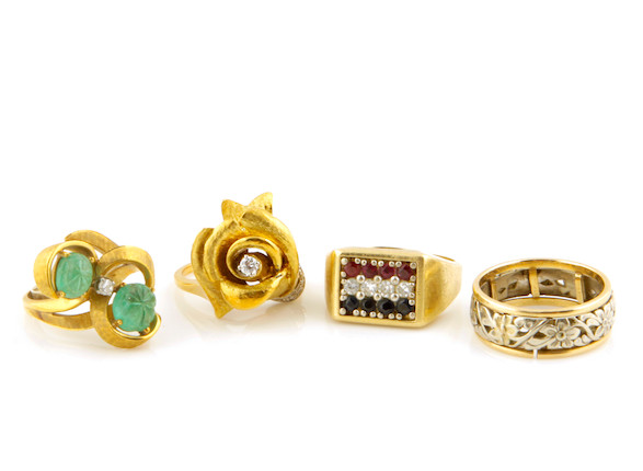 Bonhams : A collection of four gem-set and gold rings together with ...