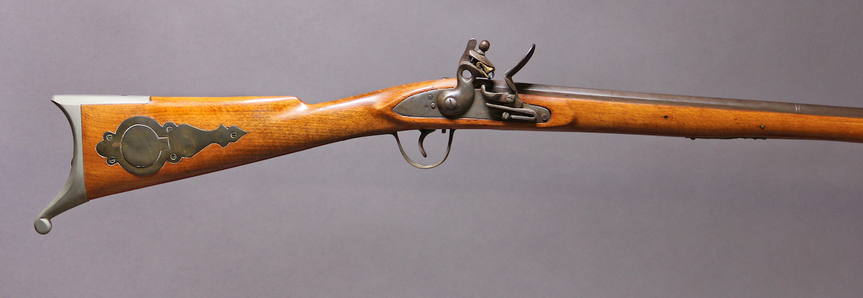 Bonhams : An unmarked reproduction flintlock rifle