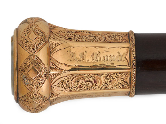 Bonhams : An American 14k gold and gold quartz headed cane and a 10k ...