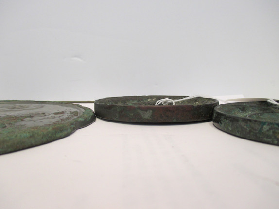 Bonhams : A group of three early mirrors Tang dynasty
