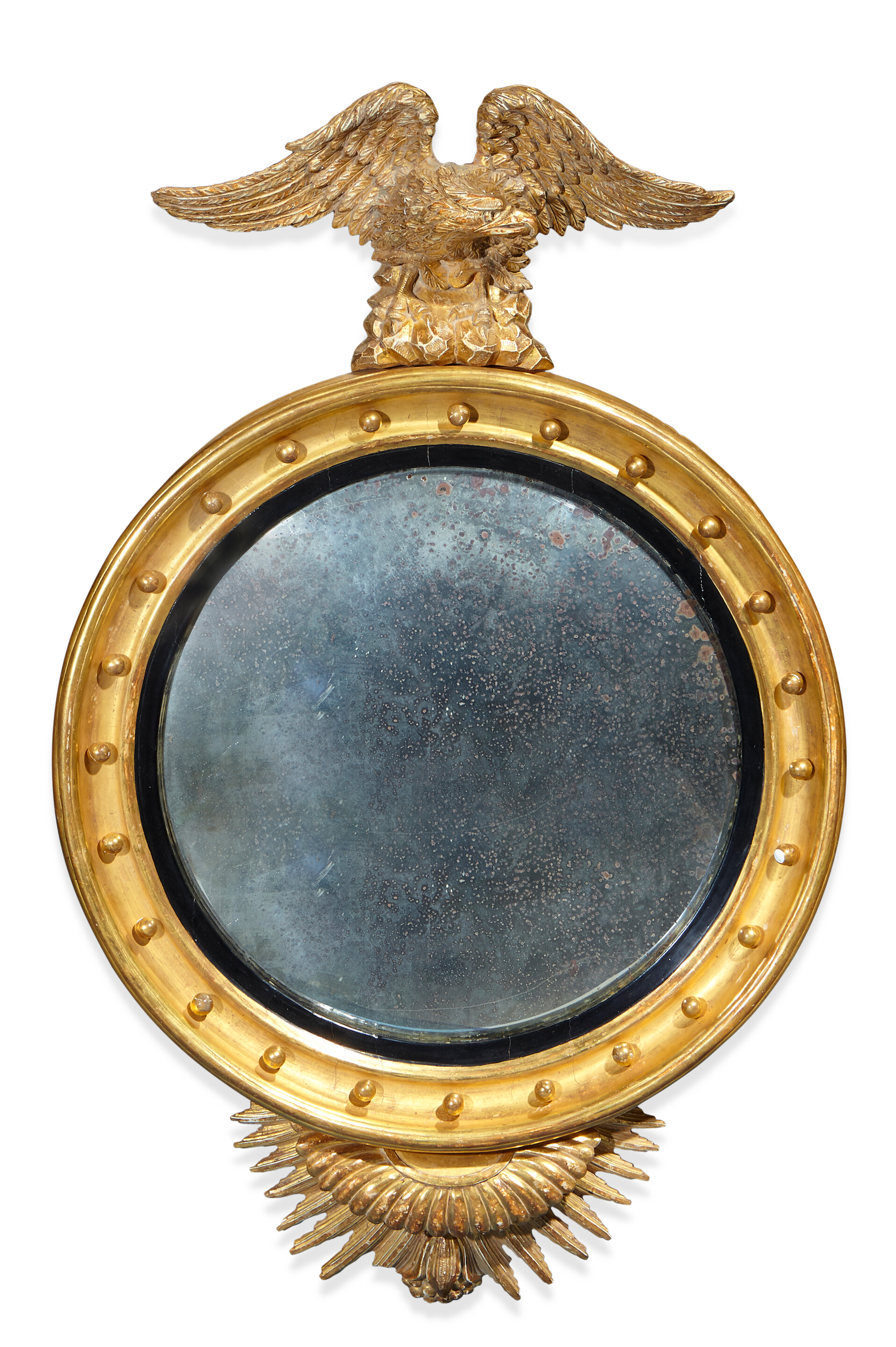 Bonhams : A Regency parcel ebonized carved giltwood convex mirror early 19th century