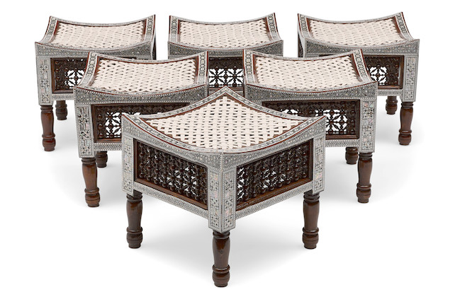 Bonhams : A set of six shell inlaid mixed wood stools of Thebes design