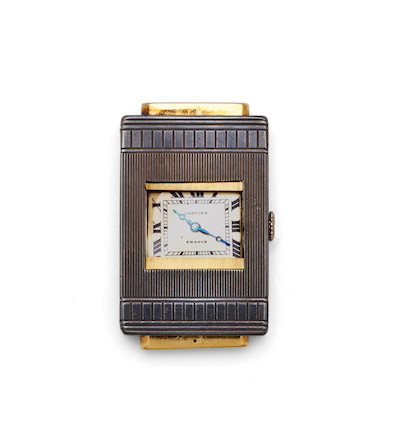 Bonhams : Cartier. A fine Art Deco gray metal manual wind purse watch ...