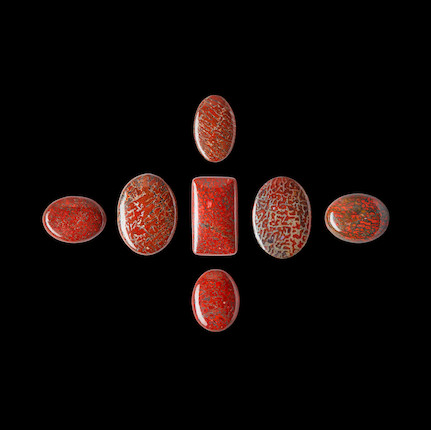 Bonhams : Seven Red Dinosaur Bone Cabochons