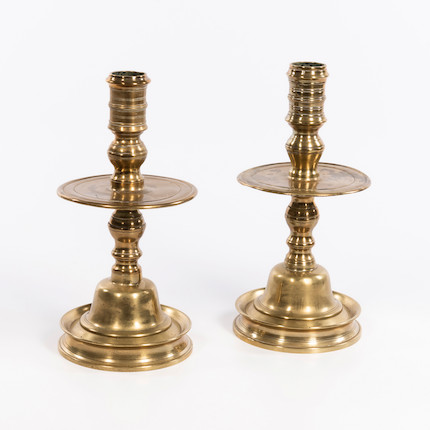 Bonhams Skinner : Two Brass Medial-drip Candlesticks, probably the ...