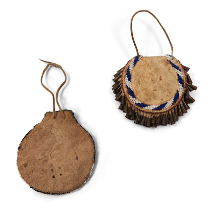 Bonhams Skinner : Two Apache beaded hide pouches size 3 3/4 x 3 3/4 and 3 1/2 x 4 in.