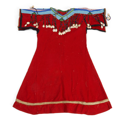Bonhams Skinner : A Plains beaded cloth dress lg. 36, wd. 30 1/4 in.