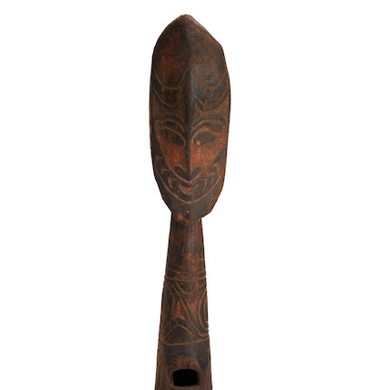 Bonhams Skinner : A New Guinea carved wood war trumpet ht. 27 1/2 in.