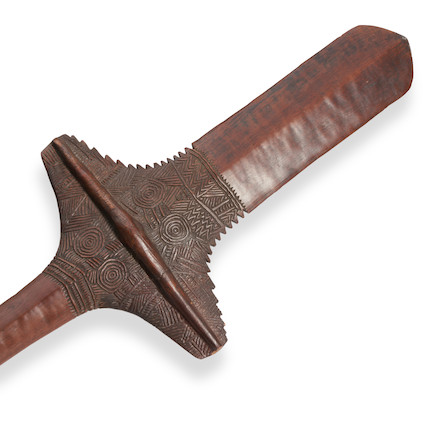 Bonhams Skinner : A Fijian hardwood dance club, kinikini lg. 40, wd. 9 in.