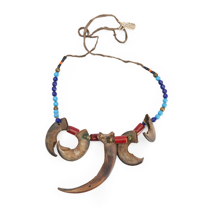 Bonhams Skinner : A Flathead bead and bear claw necklace lg. of largest ...