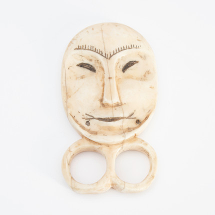 Bonhams Skinner : An Eskimo finger mask lg. 3 7/8 in.