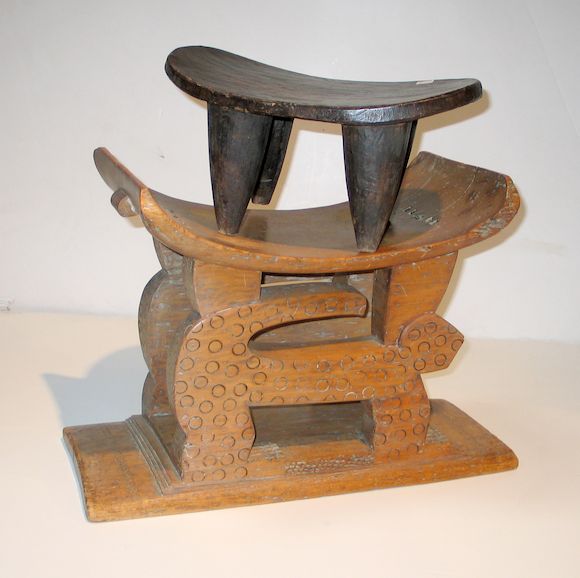 Bonhams : Two African stools; length of first 22 1/2in