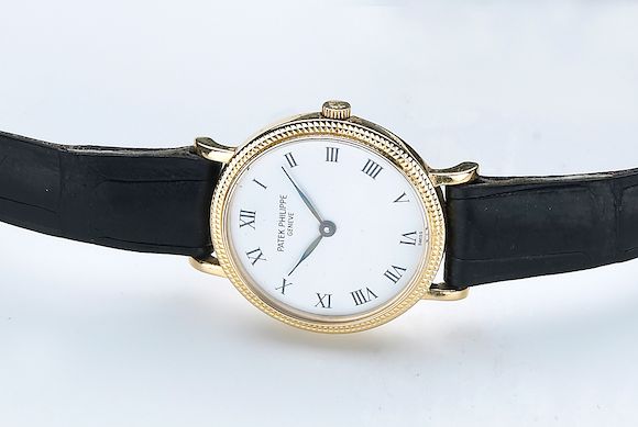 Bonhams : A lady's Patek Philippe, Geneve gold, leather strap ...