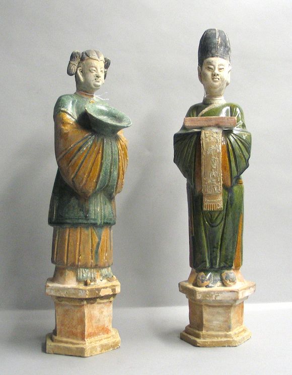 Bonhams : Two lead glazed pottery models of attendants Ming Dynasty