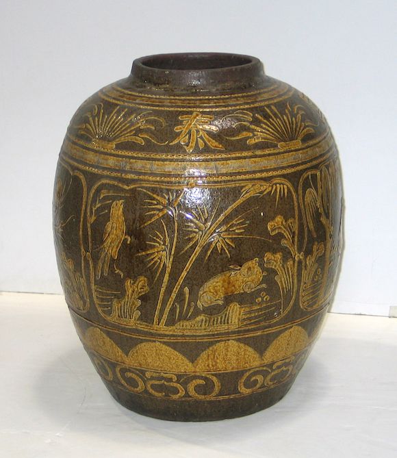 Bonhams : Two large glazed pottery trade jars