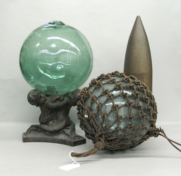 Bonhams : Two blown green glass sea floats