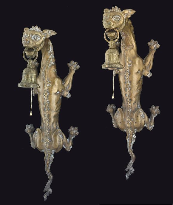 Bonhams : A pair of cast brass grotesque wall lights