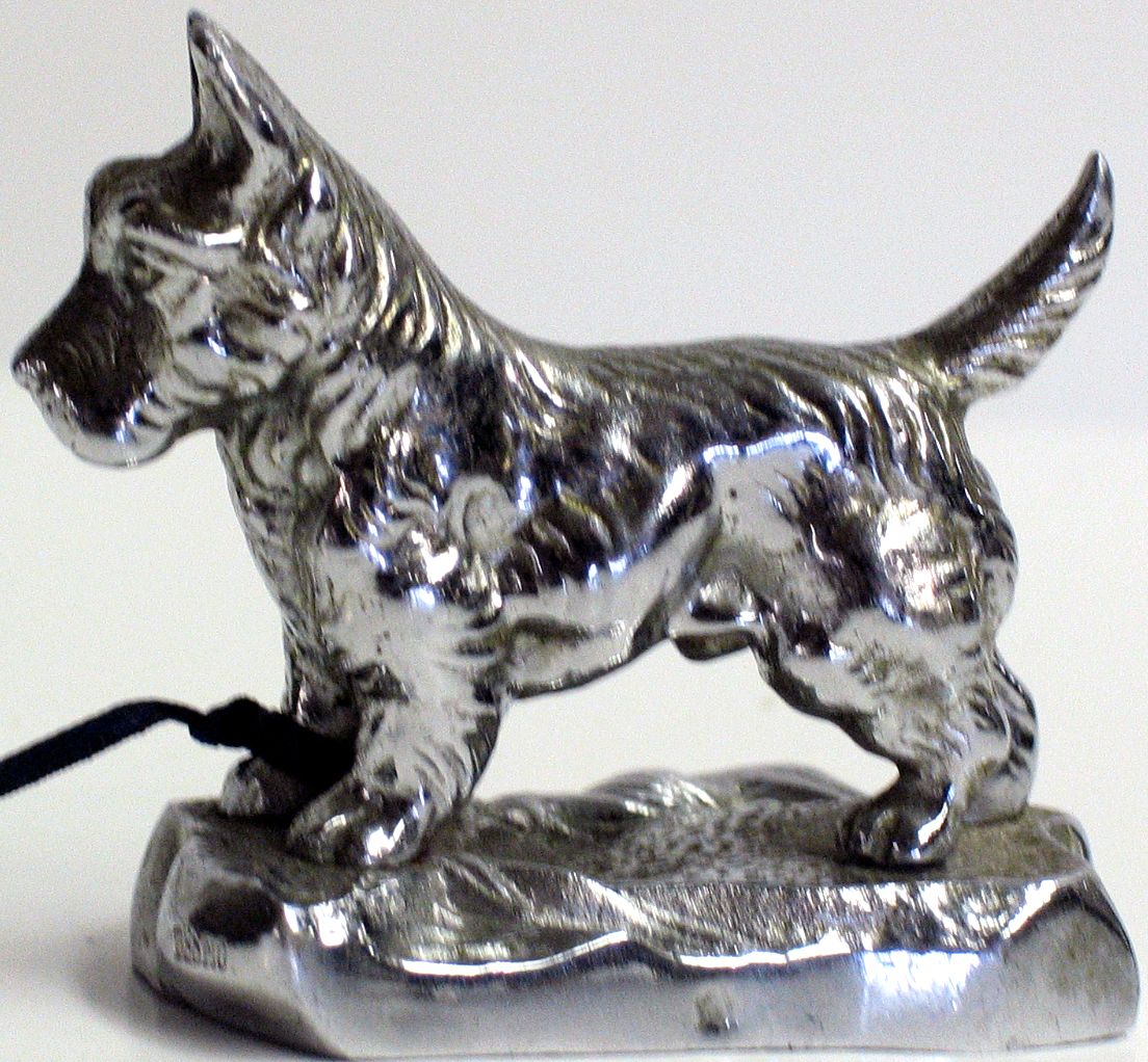Bonhams Cars : A good Scottie Dog mascot by Desmo, English, Height: 2½ ins