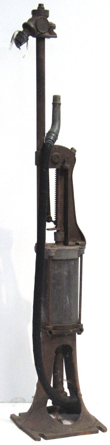 Bonhams Cars : An early hand cranking forecourt standing skeleton pump,