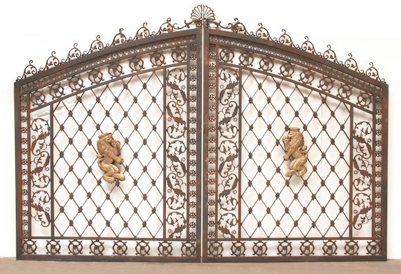 Bonhams : A pair of Neoclassical style parcel gilt and painted wrought ...