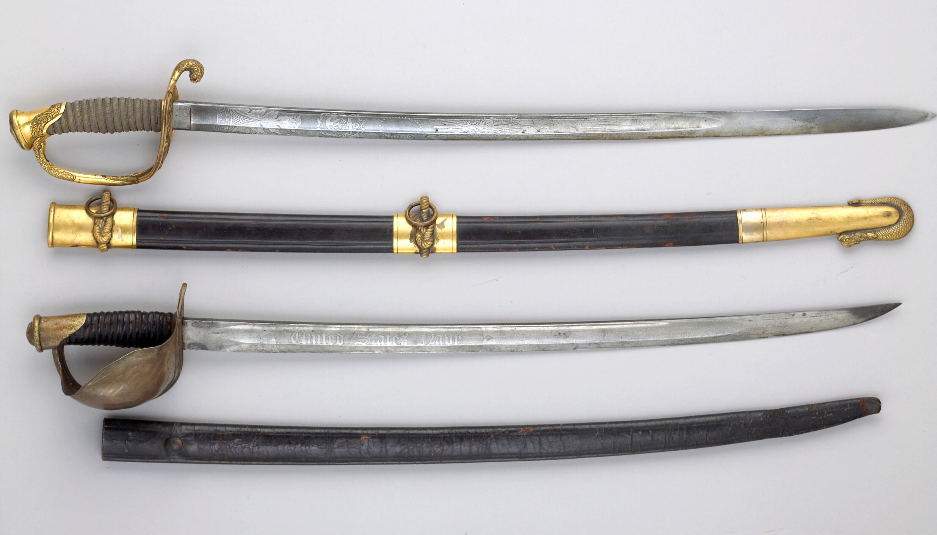 A U.S. Naval officers sword, cutlass and sword belt carried by ...