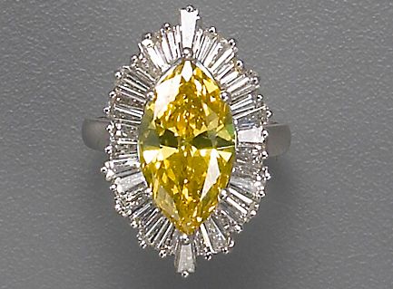 Bonhams : An irradiated colored diamond, diamond and platinum ring