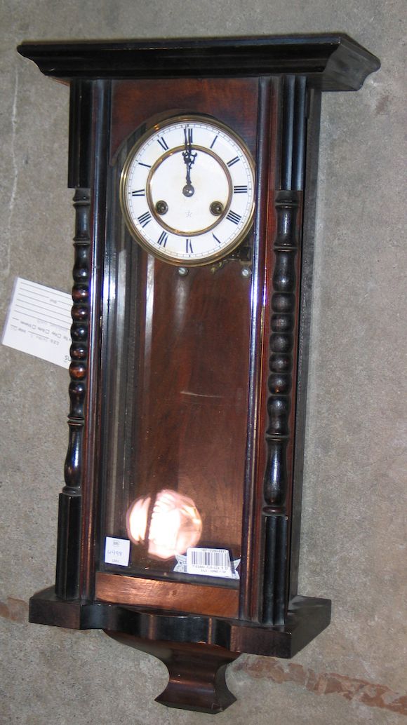 Bonhams : A German partial ebonized and carved walnut wall clock