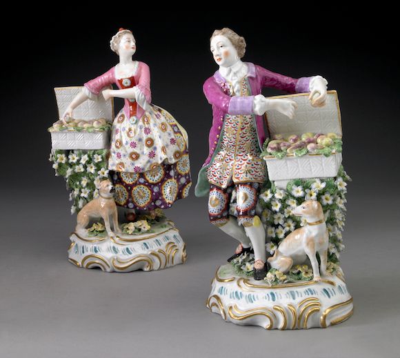 Bonhams : A pair of Chelsea style porcelain figures of fruit vendors