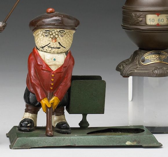 Bonhams : A pair of cast iron Hassall golf ball men, circa 1920s,