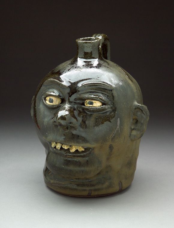 Bonhams : An American glazed stoneware grotesque jug