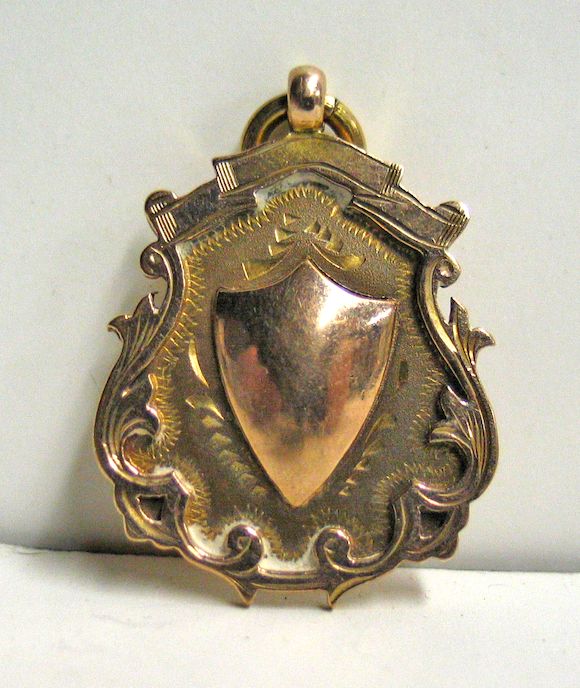 Bonhams : An N.T.G.C. 1929 Strachan Cup Winner’s gold medal and hoop.