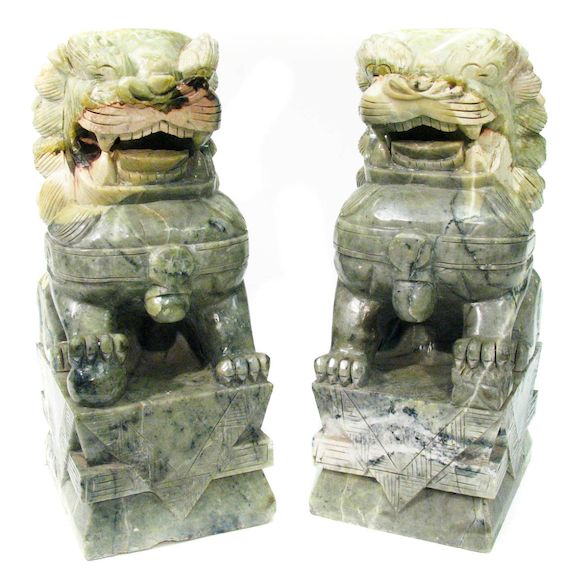 Bonhams : A pair of jade Fu dogs