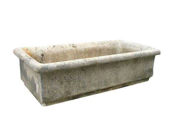 Bonhams : A cast stone trough of rectangular form with everted rim