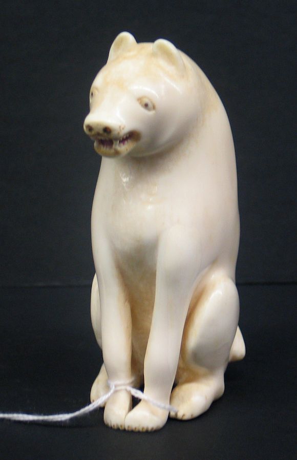 Bonhams : An Eskimo ivory carving of a husky