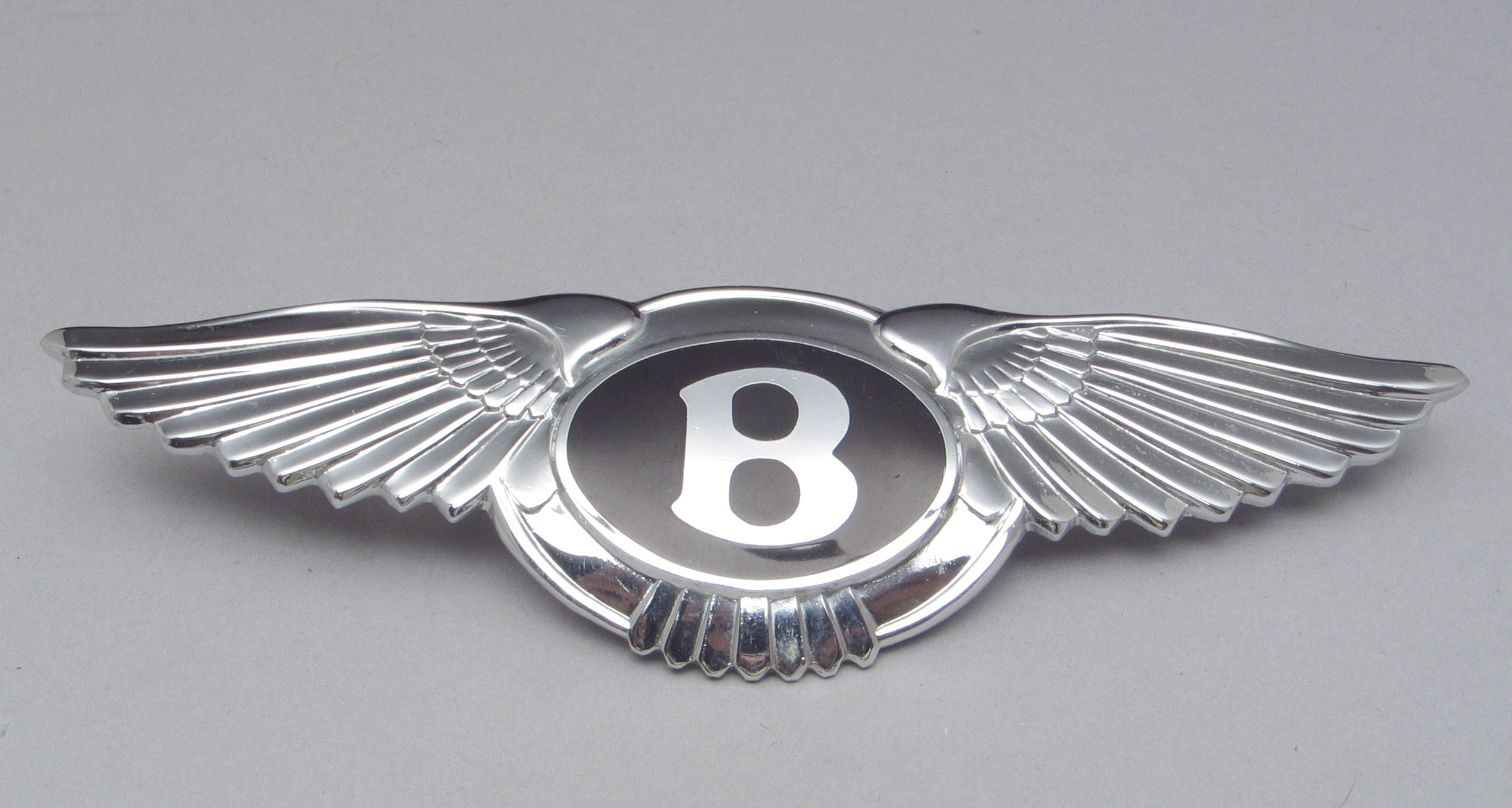 Bonhams Cars : A Bentley rear-bumper badge, 1947-1964, width 6¼in