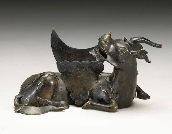 Bonhams : A cast bronze chilong-form mirror stand Qing Dynasty
