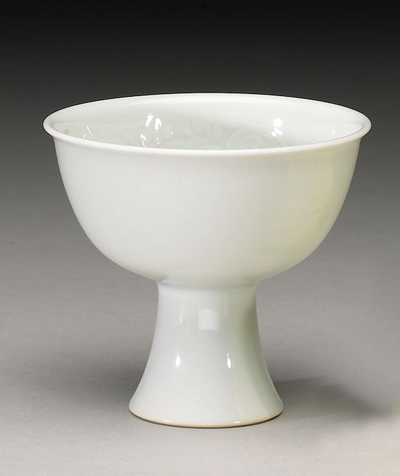 Bonhams : A molded white glazed porcelain stem cup