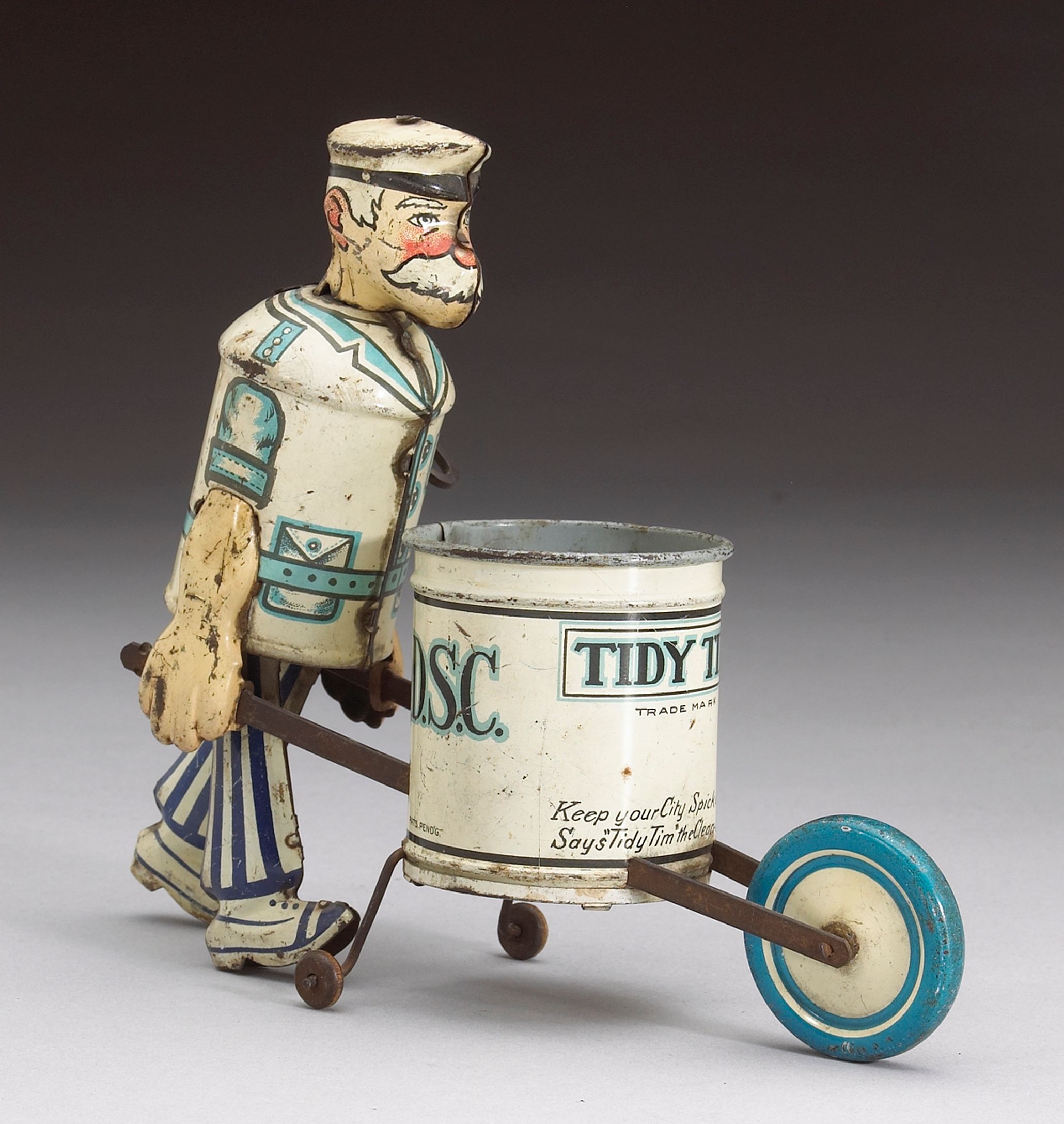 Bonhams Cars : A Tidy Tim tin wind-up toy Length: 9in