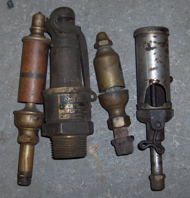 Bonhams Cars : A grouping of four small steam whistles,