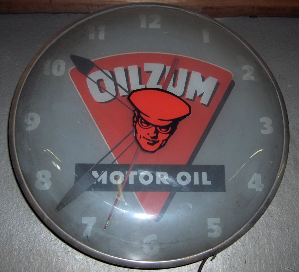 Bonhams Cars : A Oilzum electric advertising clock,