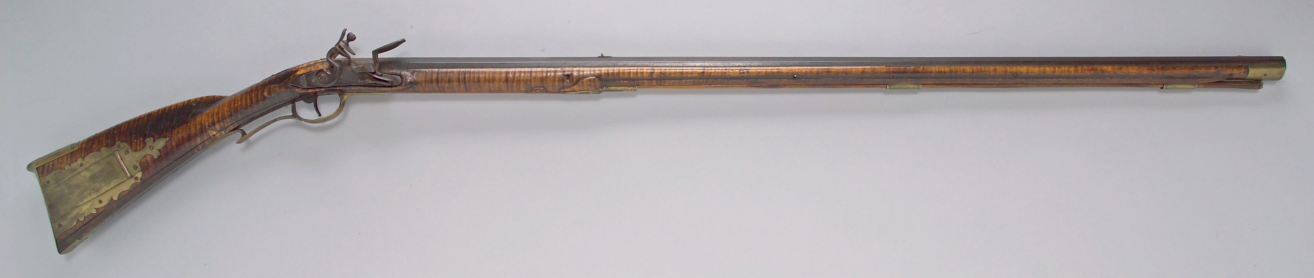 An American full-stocked flintlock buck and ball gun attributed to ...