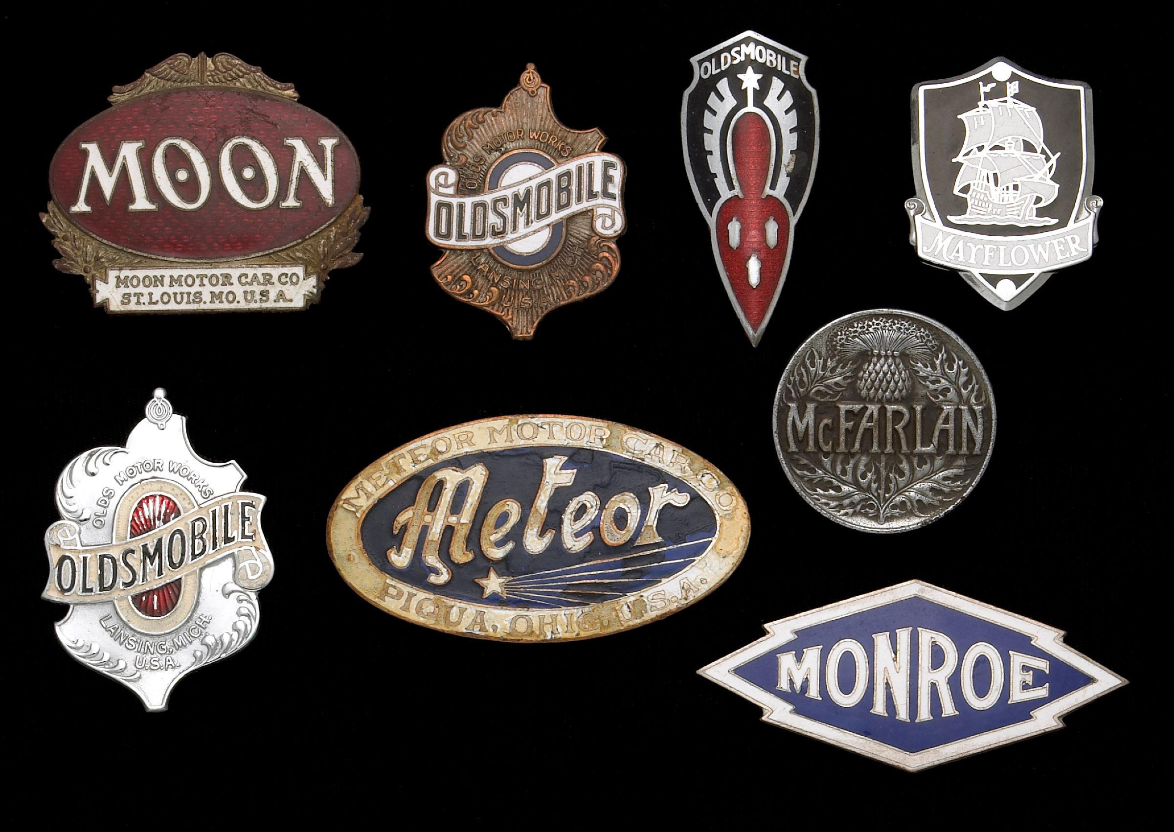 Bonhams Cars : A group of eight motor vehicle emblems,