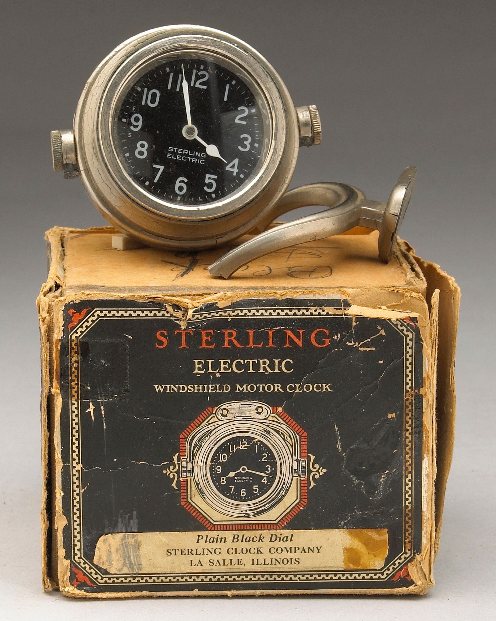 Bonhams Cars : A Sterling electric wind shield motor clock, 1920s,