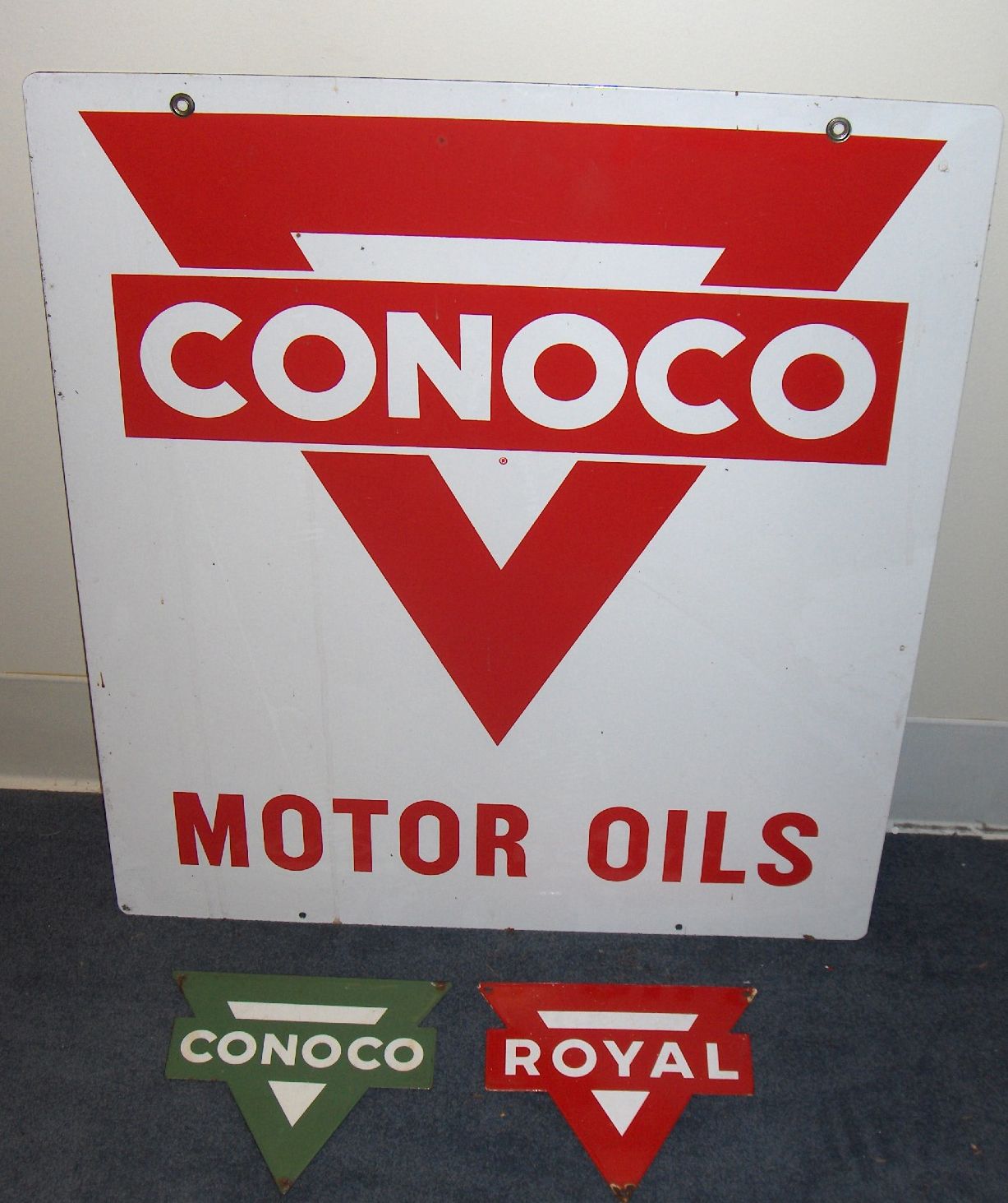 Bonhams Cars : Three Conoco Motor Oils enamel signs, the largest 30in high