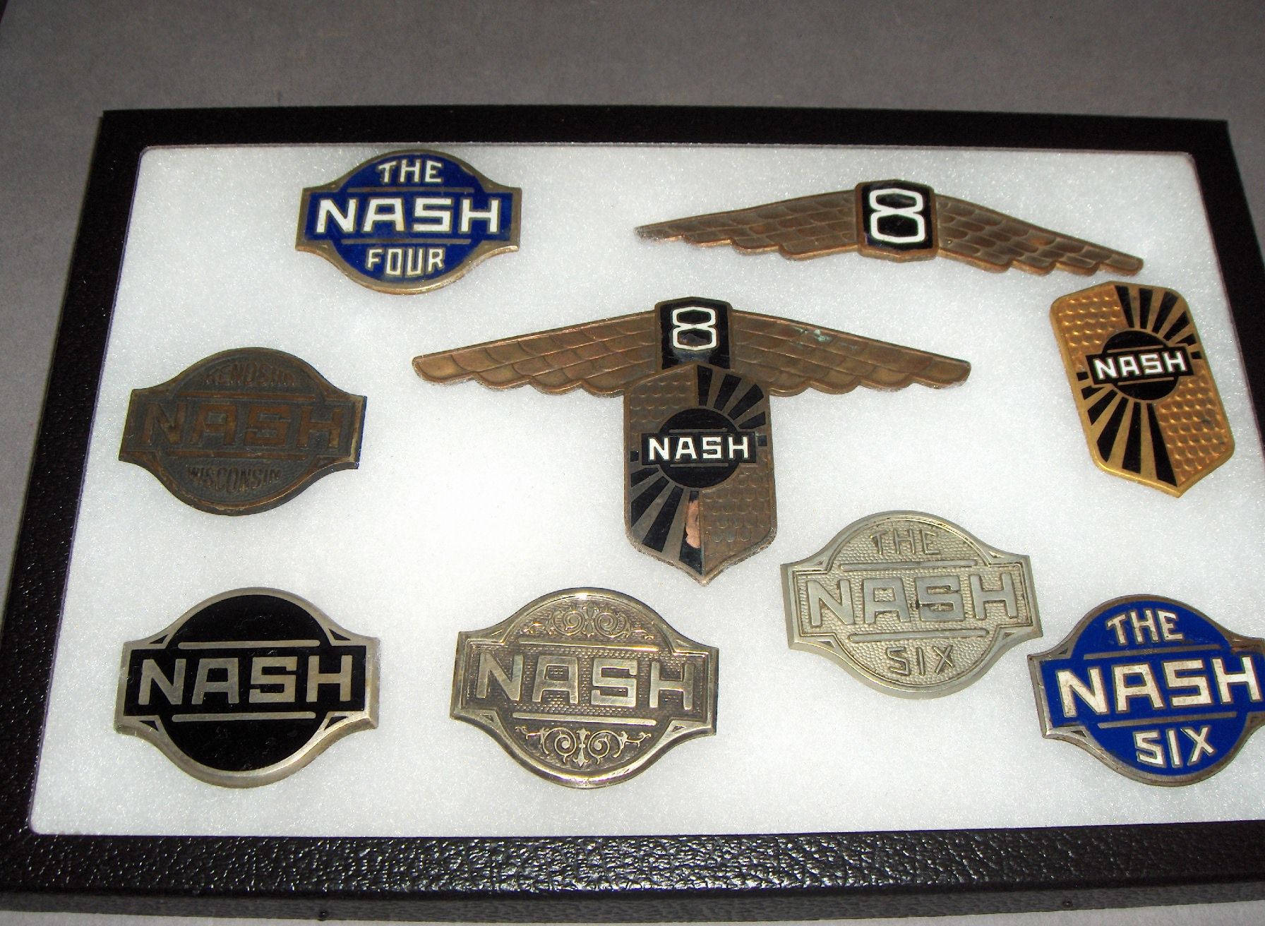 Bonhams Cars : A collection of nine Nash motor vehicle badges and emblems,