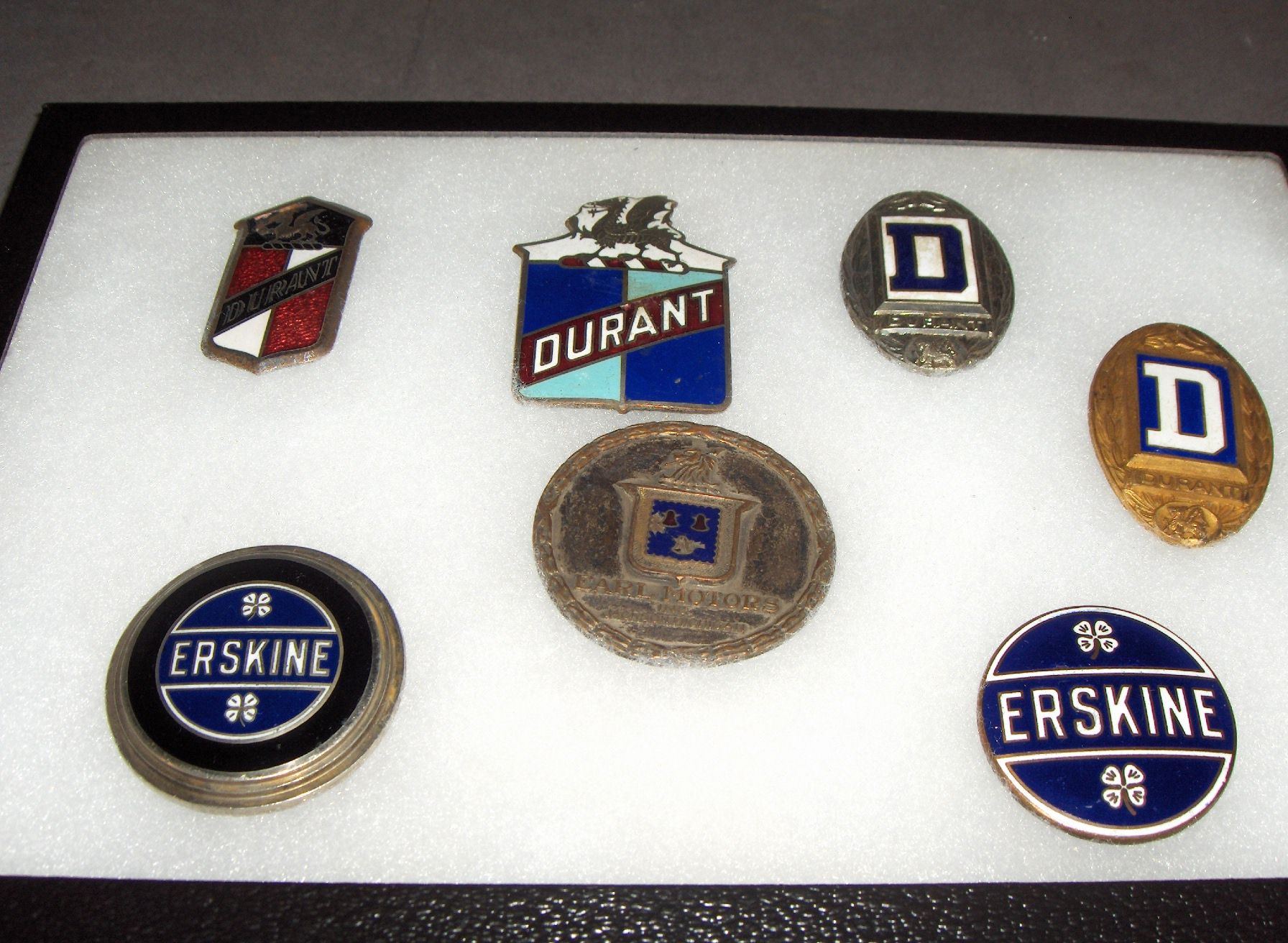 Bonhams Cars : A group of seven assorted motor vehicle emblems,