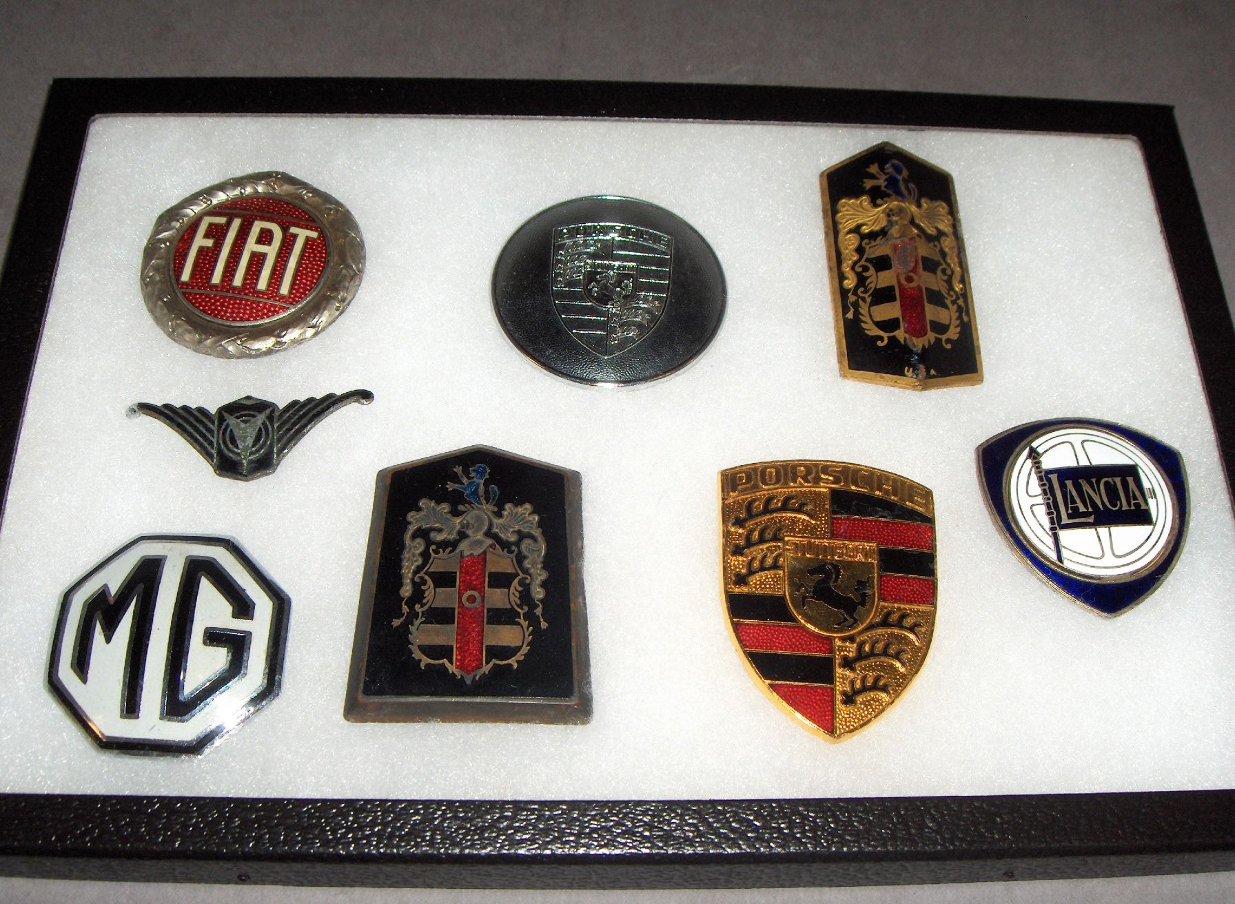 Bonhams Cars : A group of eight motor vehicle emblems,