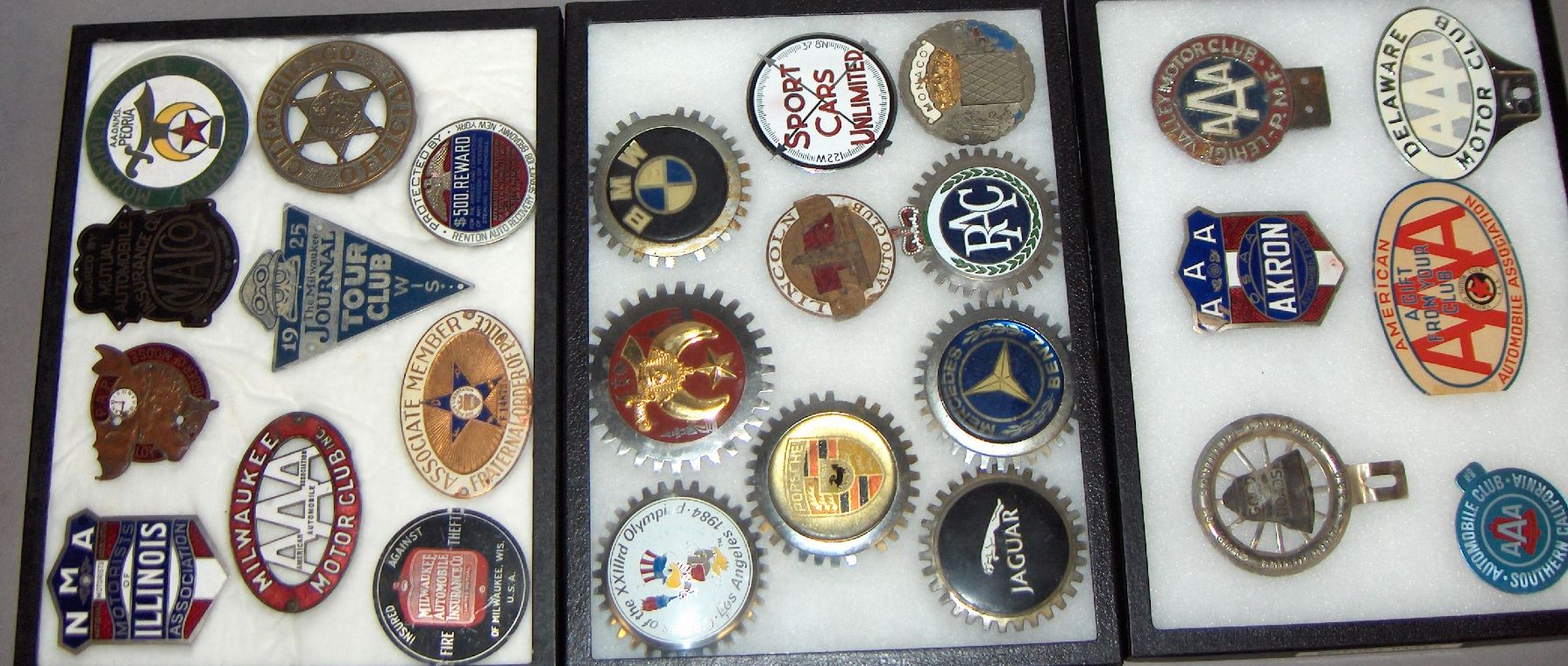 Bonhams Cars : An assortment of motoring club badges,